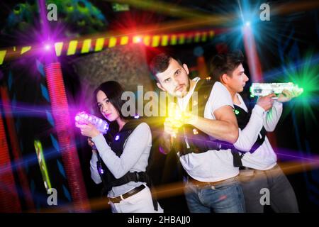 Young people playing laser tag Stock Photo - Alamy