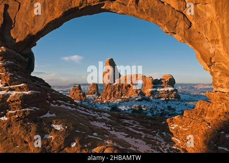 Turret Arch framed by the North Window at sunrise. Arches National Park ...