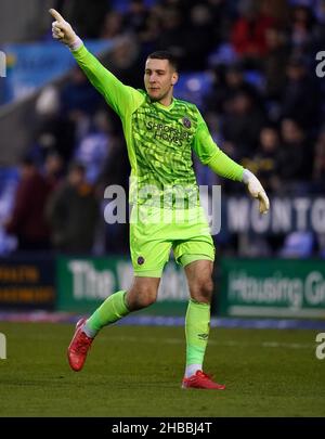 Shrewsbury Town goalkeeper Marko Marosi claims the ball under pressure ...