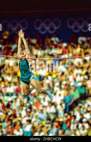 Ukrainian pole vaulter Sergey Bubka making photo by camera. Celebration of 100th anniversary of ...
