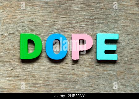 Alphabet letter in word dope on wood background Stock Photo - Alamy