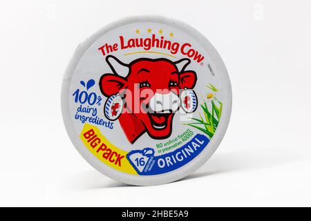An individually wrapped Laughing Cow cheese wedge photographed on a ...