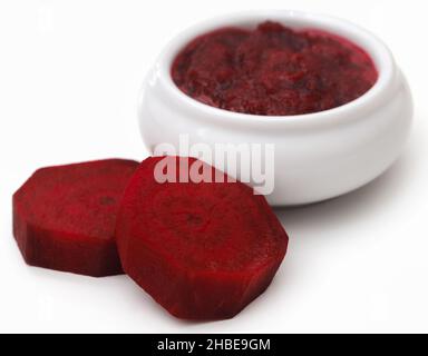 Beetroot and paste in a bowl over white background Stock Photo - Alamy