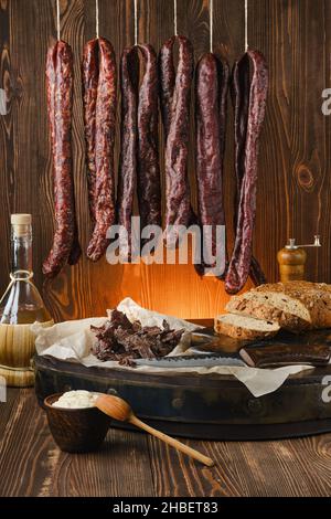 Assortment of spanish sausages and meat on display at Spanish market ...