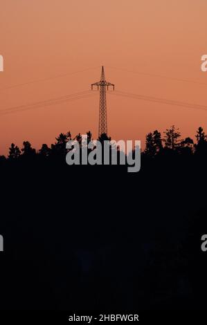 Rottweil, Germany. 19th Dec, 2021. The full moon rises behind the TK ...