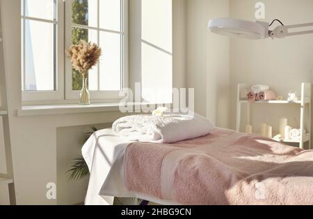 Beautician's office, spa center, massage room, or spa salon with bed and magnifying lamp Stock ...