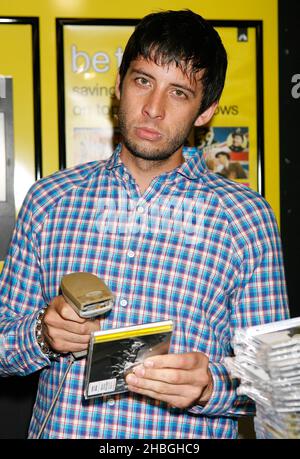 Example signs copies aka his new album, Playing In The Shadows, at HMV ...