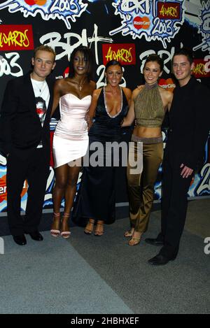 Liberty X photographed at the 2003 Brit Awards in London. 3/4 length ...