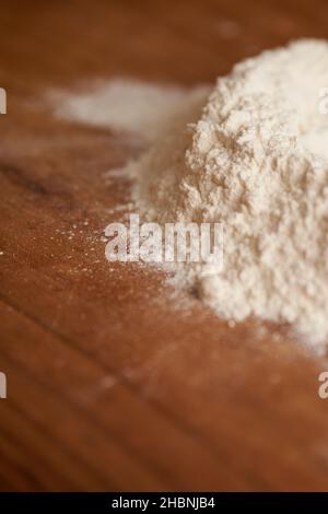 wheat flour volcano on the flour counter and rolling pin Stock Photo ...
