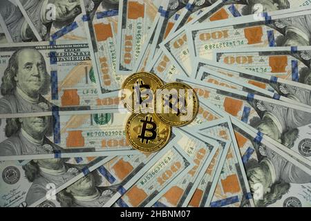 Bitcoin coin with dollars, golden symbolic Bitcoin coin on one hundred ...