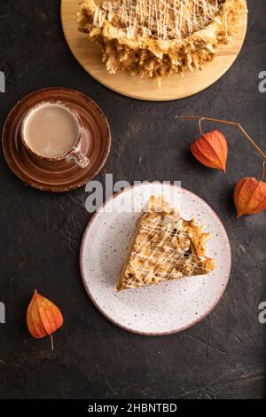 Traditional lithuanian cake shakotis with cup of coffee on blue wooden ...