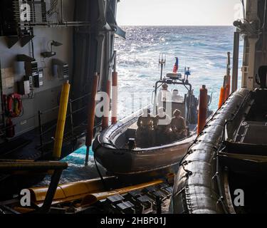 US Navy Sailors launch the Rigid Hull Inflatable Boat (RHIB) to conduct ...