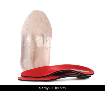 Beige and red orthopedic insoles on white background Stock Photo - Alamy