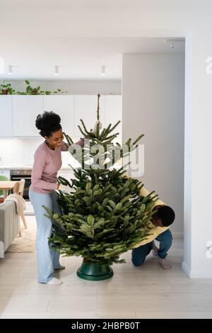 Happy african couple prepare for New year at home, black man and woman ...