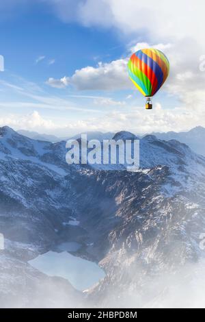 Dramatic Mountain Landscape and Hot Air Balloon Flying Stock Photo - Alamy