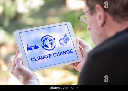 Tablet screen displaying a climate change concept Stock Photo - Alamy