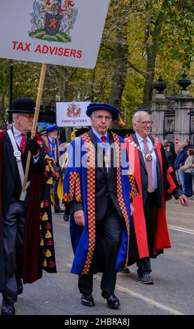 Modern Livery Companies march in ceremonial robes holding signs in the ...