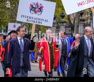 Modern Livery Companies march in ceremonial robes holding signs in the ...