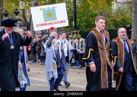 Modern Livery Companies march in ceremonial robes holding signs in the ...