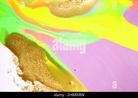 Mix of acrylic vivid colorful inks with gold dust Stock Photo - Alamy