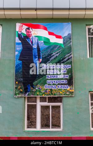 A portrait of Tajik President Emomali Rahmon hangs over a swimming pool ...