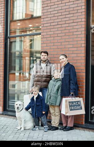 Caucasian boy with big black dog Stock Photo - Alamy
