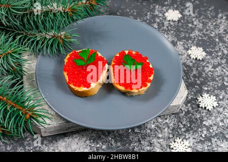 Festive sandwich with red caviar for party. Vertical format. Top view ...