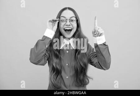 Genius idea. Girl genius with raised finger. Child prodigy in ...