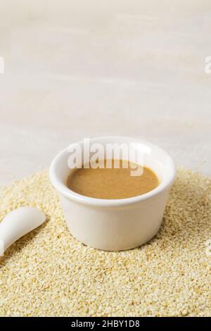Creamy tahini sauce in a small metal bowl on white background Stock ...