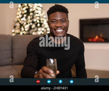 Screenshot Of Black Guy Video Calling Holding Christmas Gift Indoor ...