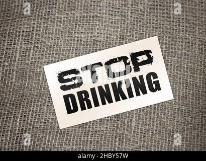 Stop drinking words on card on wooden table. Addictions healthcare ...