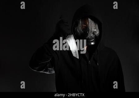 The horror man with skull mask standing in the dark Stock Photo - Alamy
