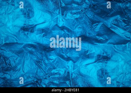 Used blue color wrapped shiny polythene texture for background Stock ...