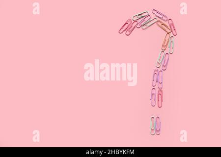 Question mark made of paper clips on orange background Stock Photo - Alamy
