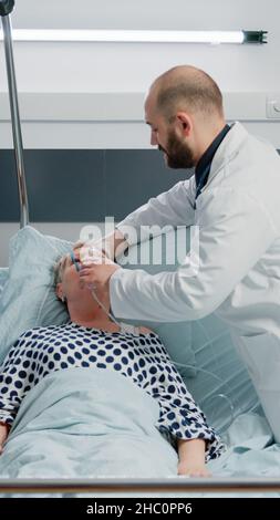 doctor rushing to senior patient with breathing mask on ambulance ...