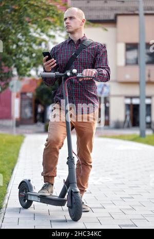 Mobile phone with transportation and buildings on blue background. From ...