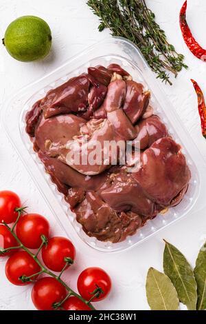 Chicken liver container set, on black wooden table background, top view ...