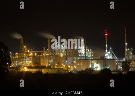 Oil Refinery in Sarroch, Sardinia, Italy at night Stock Photo - Alamy