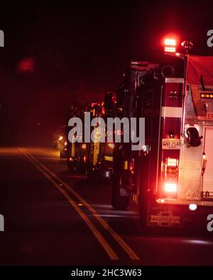 Vertical shot of fire engines at night Stock Photo - Alamy