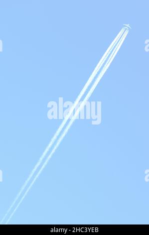 Traces and white streaks from jet engines in the plane, white stripes ...