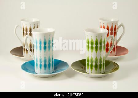 Closeup shot of vintage ceramic cups isolated on a black background ...