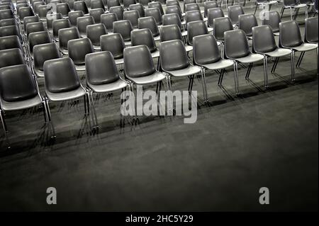 Gray empty audience seats arranged in rows Stock Photo - Alamy