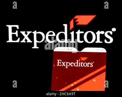 In this photo illustration the Expeditors logo seen displayed on a ...