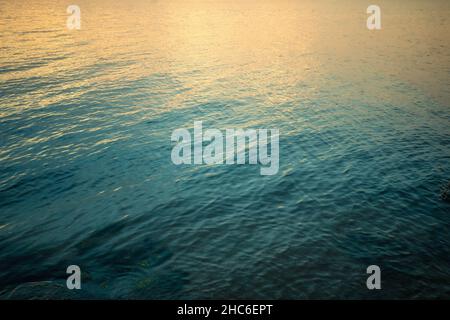 Top view of seawater at sunset. Abstract nature landscape background ...