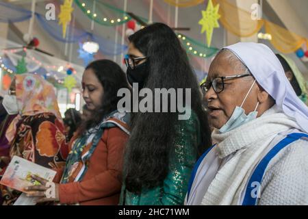 Christian Devotees wearing masks attend prayers at a Holy Rosary ...