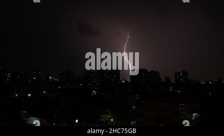Lightning storm over city of Maputo at night. Mozambique, November 2021 ...