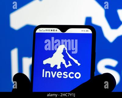 In this photo illustration, the Invesco logo is seen on a smartphone ...