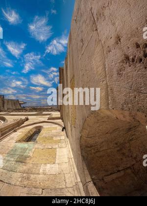 Vertical shot of a landscape with a brick building background in ...