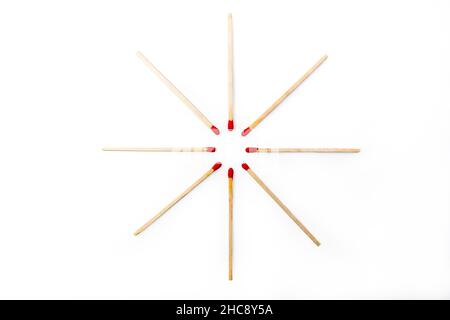 Matchsticks radially spaced on a white background. Different angle ...