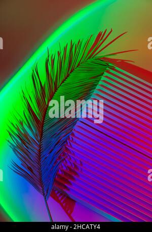 Neon glowing leaves on a blue background Stock Photo - Alamy
